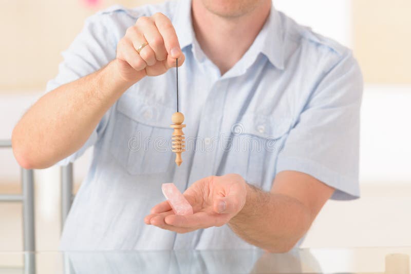 Man with pendulum stock image. Image of metaphysical - 41620195