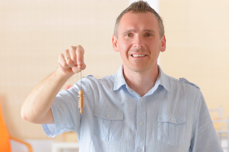 Man with pendulum stock image. Image of foresight, alternative - 42476625