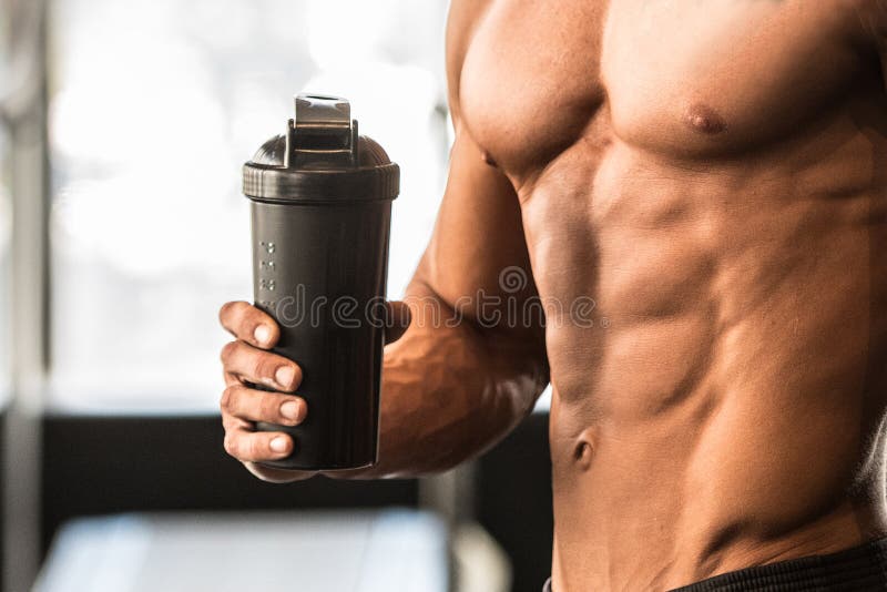 Man with Perfect Body Holds Protein Shaker in the Gym after Workout ...