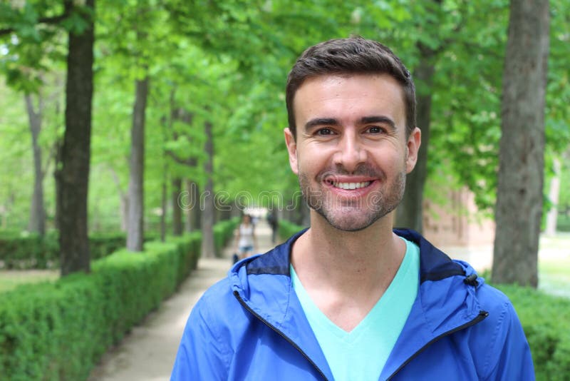 Man with a Perfect Smile Outside in the Park Stock Image - Image of ...