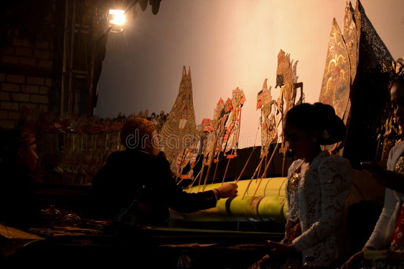 A Man Perform with Wayang or Traditional Javanese Puppet on Stage at ...