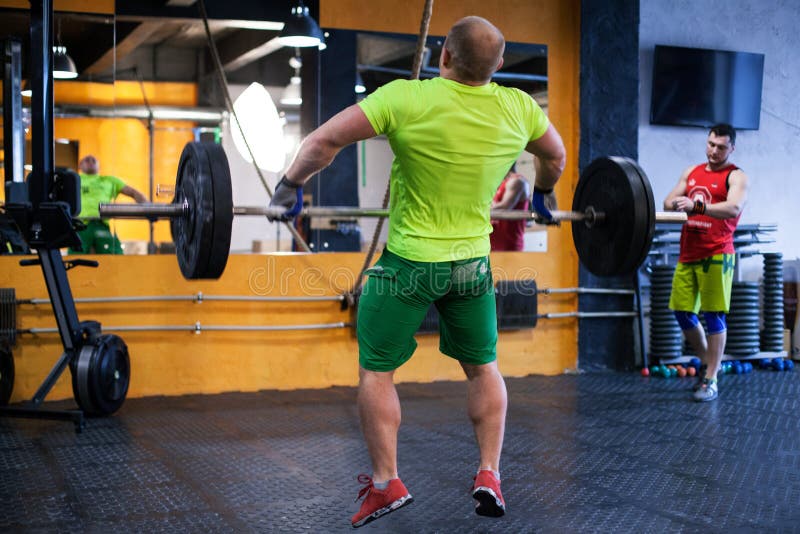 Muscular Man At A Crossfit Gym Lifting A Barbell Stock Image Image