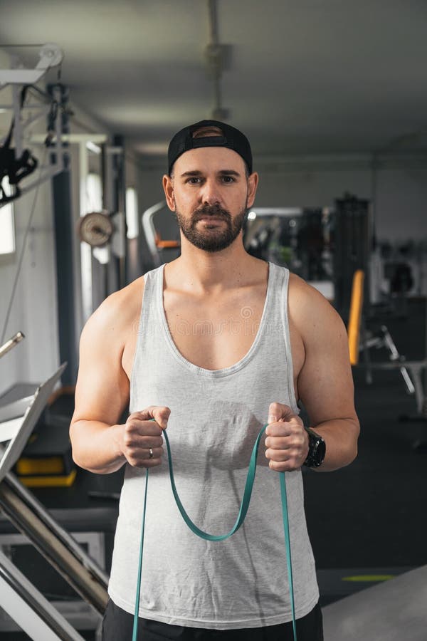 Man Performing Exercises with an Elastic Band. Stock Photo - Image of ...