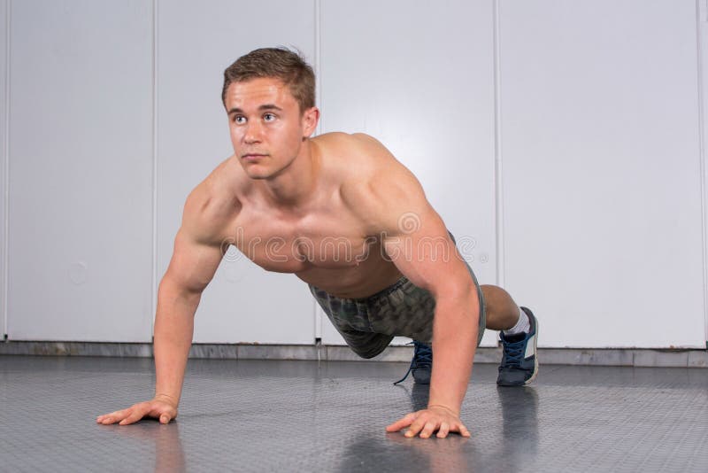 Man Performing Push Ups at the Gym Stock Photo - Image of bodybuilder ...
