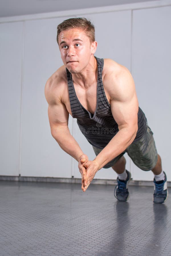 Man Performing Push Ups at the Gym Stock Photo - Image of bodybuilder ...