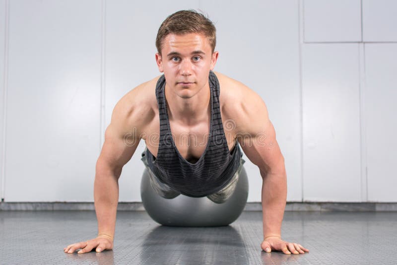 Man Performing Push Ups at the Gym Stock Photo - Image of bodybuilder ...