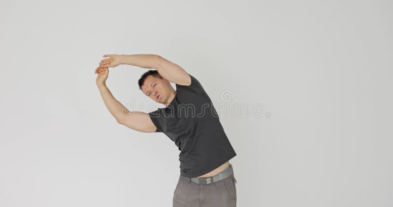 Man Performs an Arm Stretching Exercise on White Background Stock ...