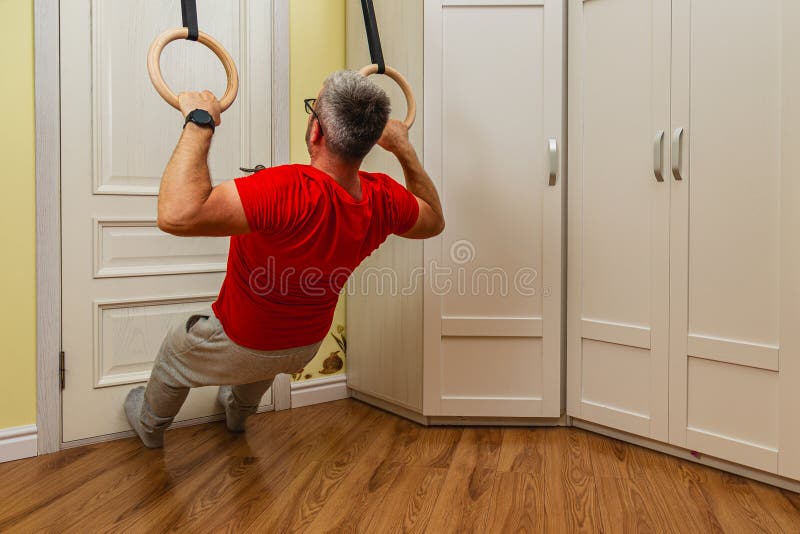 Man Doing Gymnastic Rings Workout at Home Stock Image - Image of ...