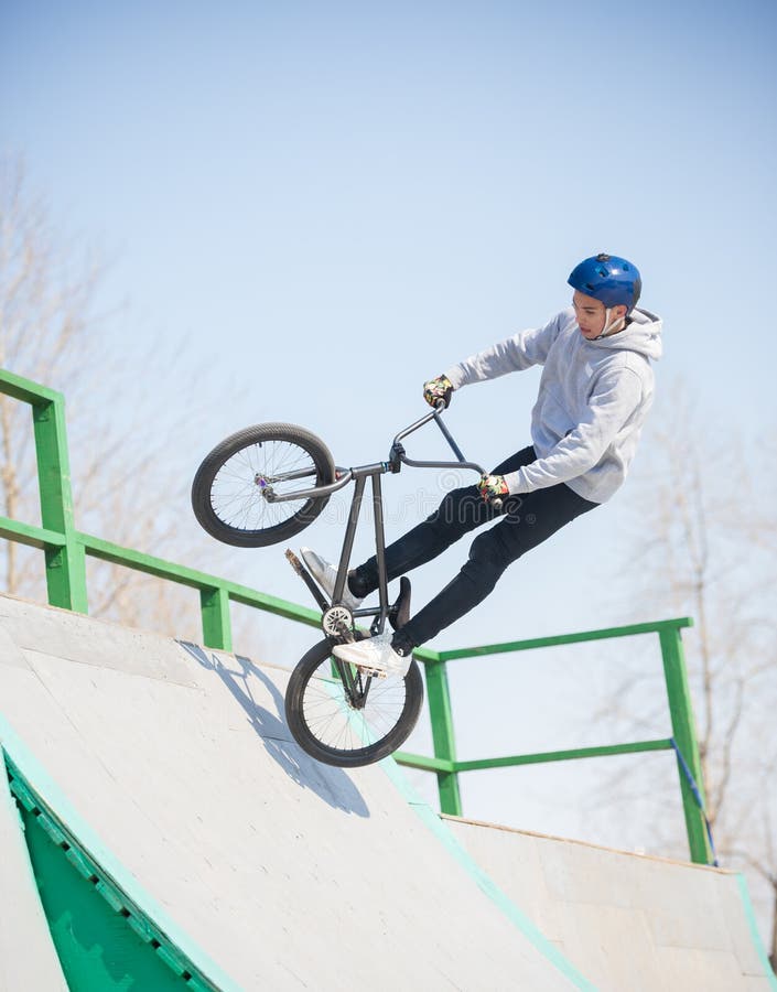 A Man Performs Tricks on a Bicycle on the Half Pipes Stock Photo ...