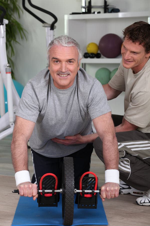 Man with personal trainer stock photo. Image of strong - 31992254