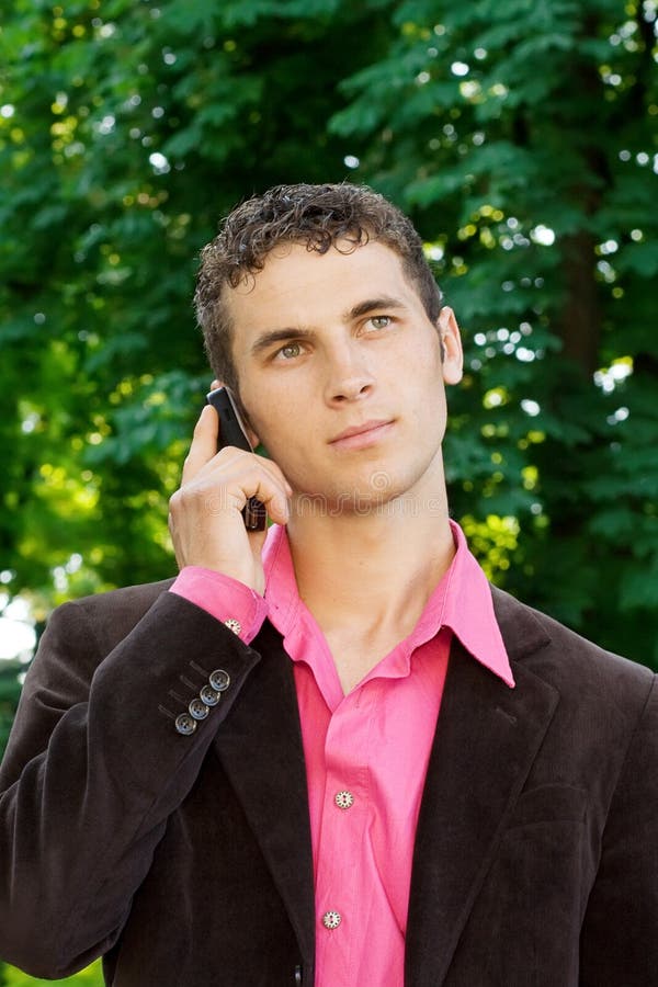 Young man on cell phone stock image. Image of electronics - 3520863