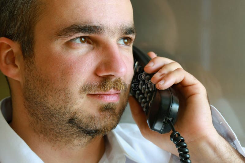 Man on the phone stock image. Image of attractive, male - 6913129