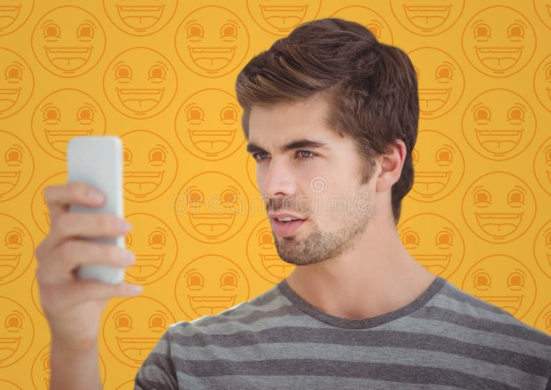 Man with Phone Against Yellow Emoji Pattern Stock Photo - Image of ...