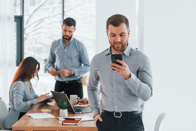 Man with Phone. Group of Business People that Working on the Project in ...