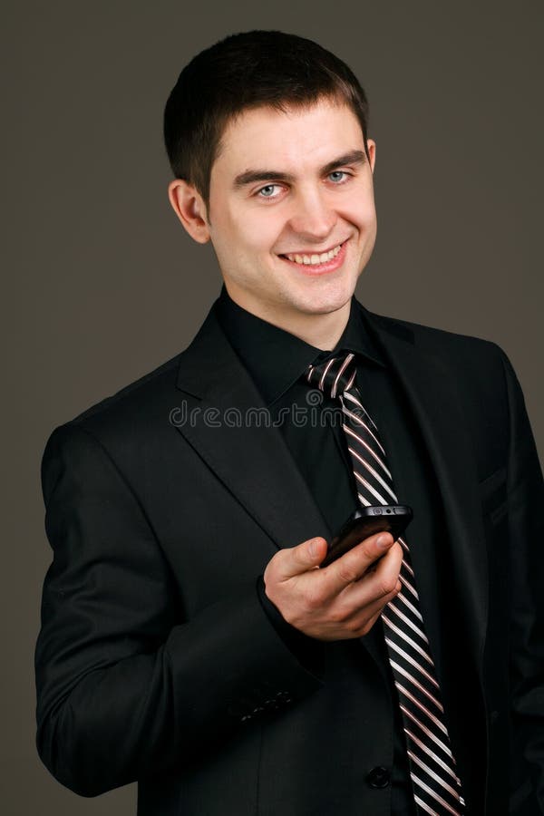 Man with phone smiling stock image. Image of black, listening - 26685413