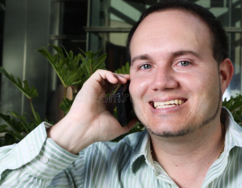 Man on the phone smiling stock photo. Image of young, white - 6983570