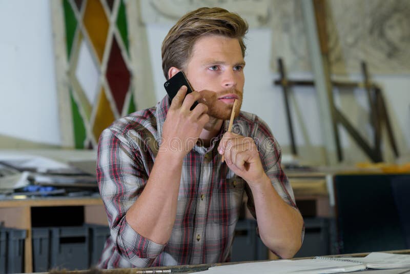 Man on phone thinking stock photo. Image of businessman - 315975452