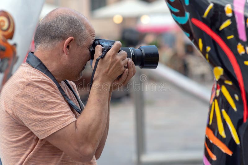 A Man with a Photo Camera Photographed on the Street. Stock Image ...