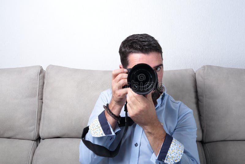 Man with Photo Camera Working Stock Photo - Image of couch, sight: 60401070