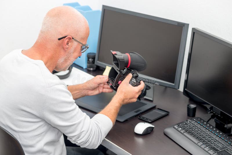 Photographer with Camera at Office with Computer Stock Image - Image of ...