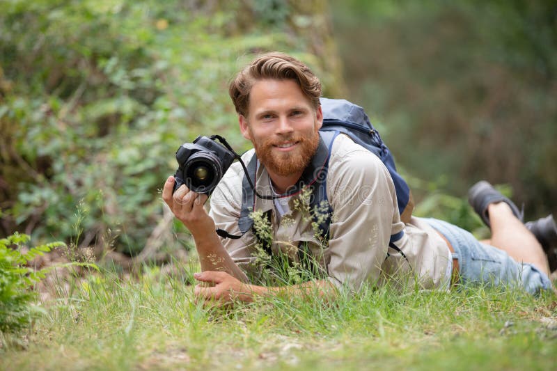 Photographer Looking into Viewfinder of Digital Camera Stand on Tripod ...