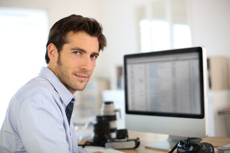 Photographer Working At Office Stock Photo - Image of professional ... Photographer Working At Office Stock Photo - Image of professional ...