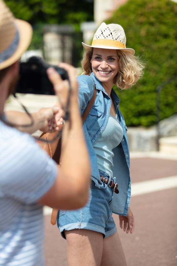 Man Photographing Girlfriend on Summer Day Stock Photo - Image of ...