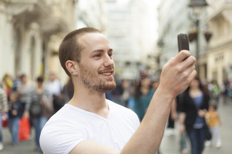 Man Photographing with Smart-phone Stock Image - Image of city, people ...