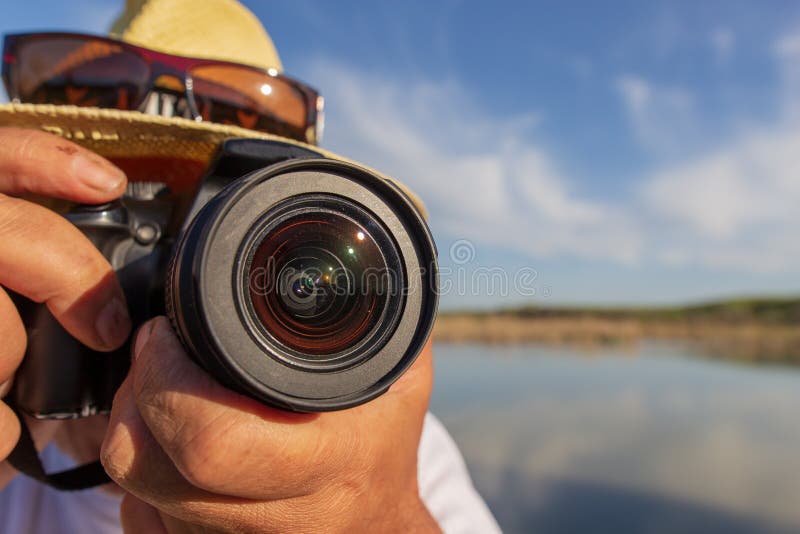 A Man Photographs Nature from a Camera Stock Photo - Image of blue ...