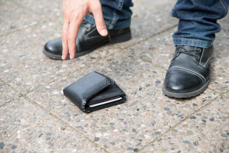 Man Picking Up Fallen Wallet Stock Image - Image of caucasian, floor ...