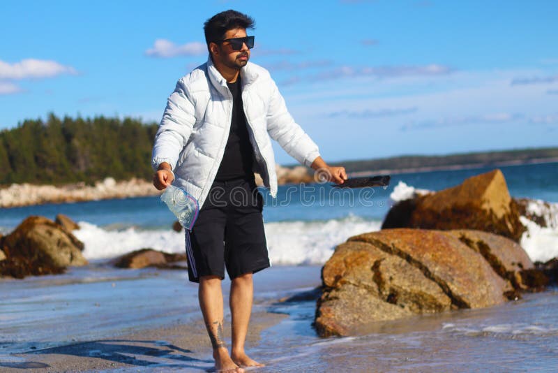 Man Picking Up Litter on Beach. Stock Image - Image of looks, closed ...