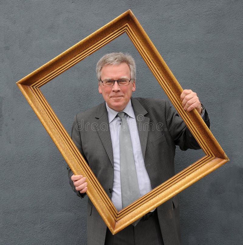 Man with picture frame stock photo. Image of golden, business - 49774316