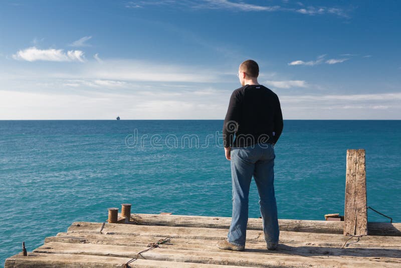 Man at pier stock image. Image of standing, breakers - 16830021