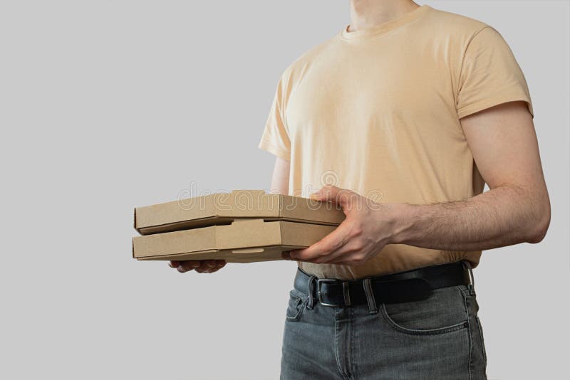 A Man with Pizza Boxes in His Hands Stock Image - Image of person ...