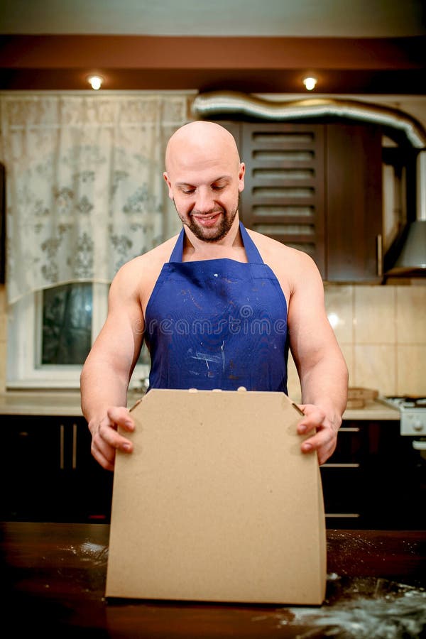 Man with pizza stock image. Image of kitchen, cook, flour - 112128071