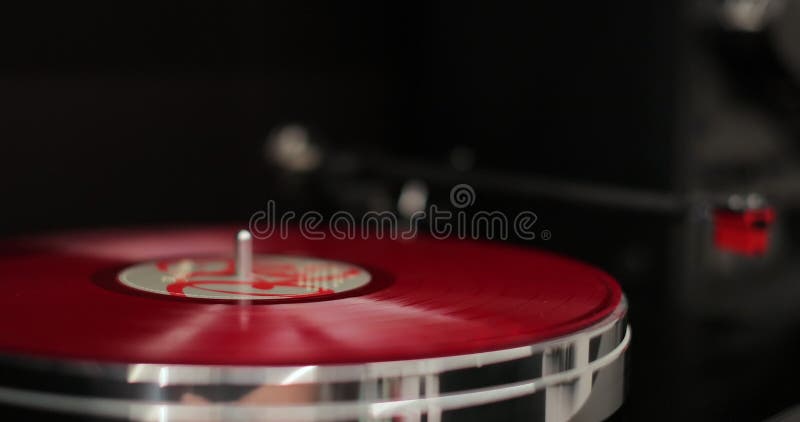 Man Places a Red Disk on a Vinyl Player. Vinyl Record Gets Placed on a ...