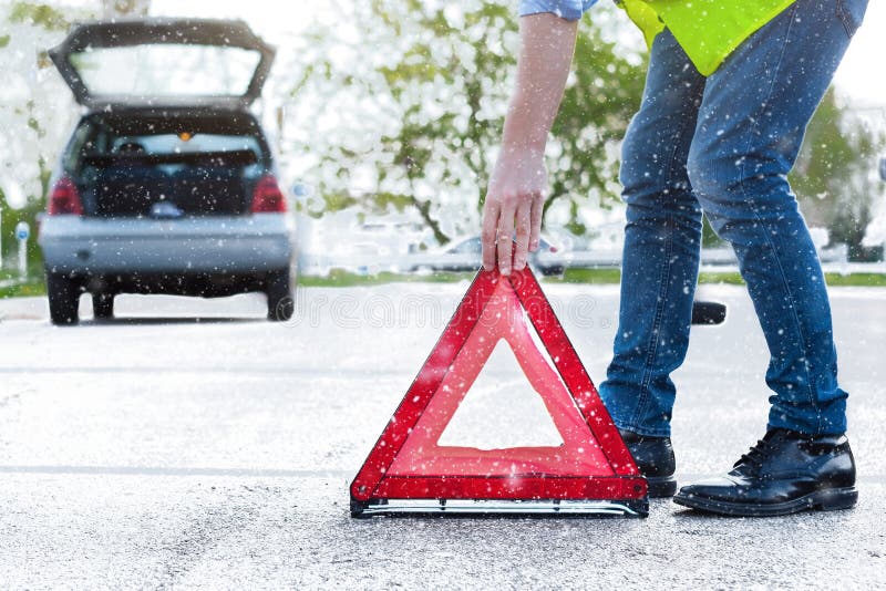 Man Placing a Reflective Red Triangle Stock Photo - Image of accident ...