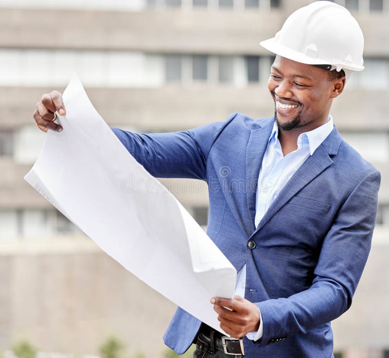 The Man with the Plan. a Handsome Young Male Engineer Reading ...