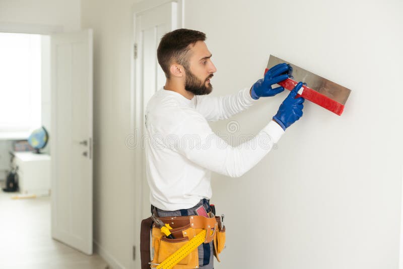 Man Plasterer Construction Worker at Work, Takes Plaster from Bucket ...