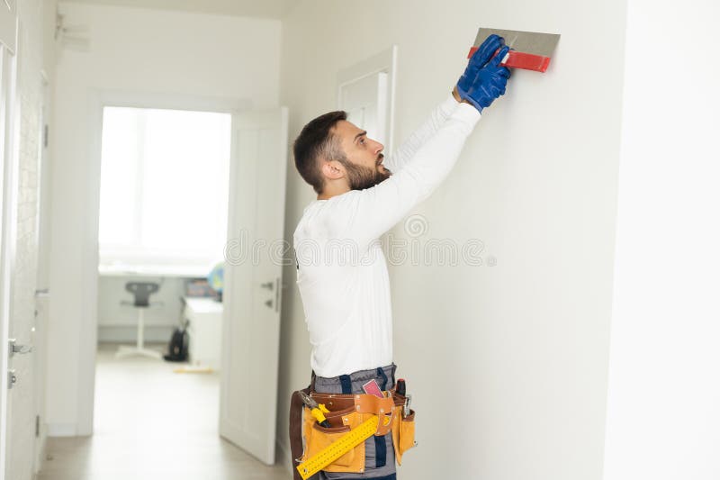 Man Plasterer Construction Worker at Work, Takes Plaster from Bucket ...