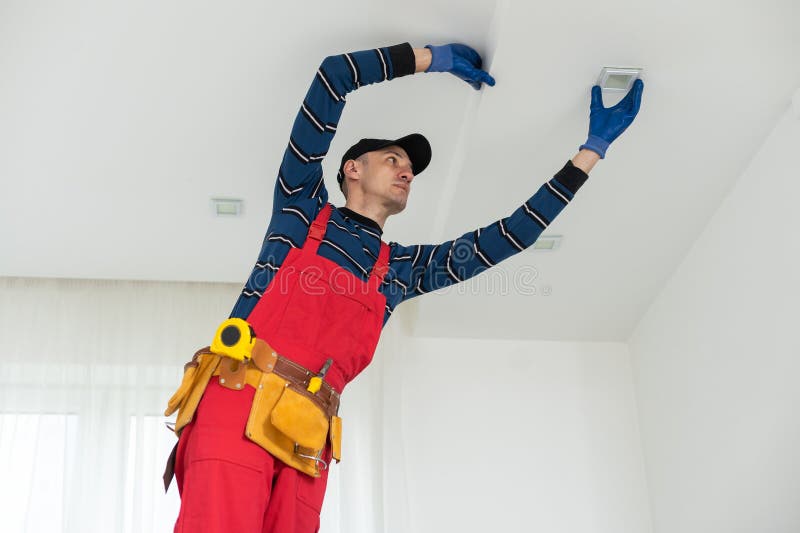 Man Plasterer Construction Worker at Work, Takes Plaster from Bucket ...