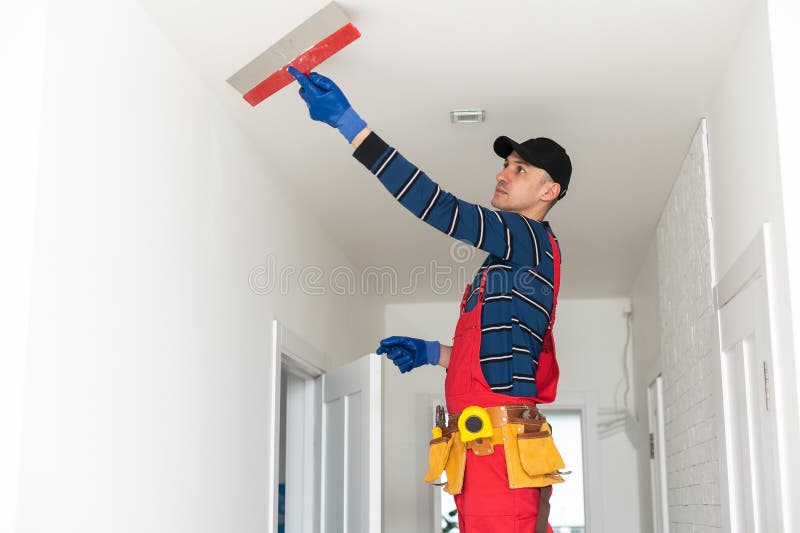 Man Plasterer Construction Worker at Work, Takes Plaster from Bucket ...