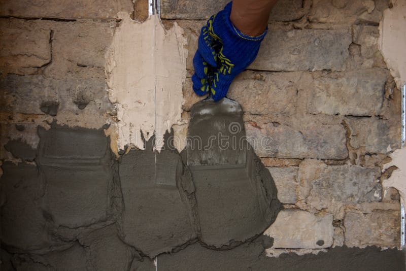 Man Plastering the Wall. Construction, Repairs in the House Stock Photo ...