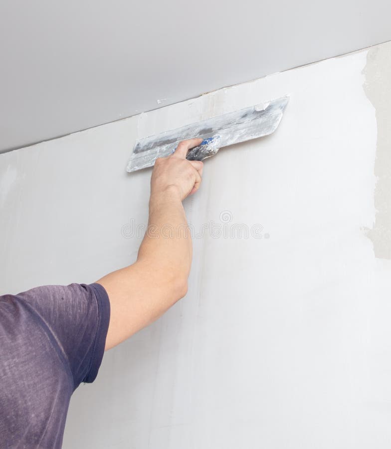 A Man is Plastering a Wall in the House Stock Photo - Image of interior ...