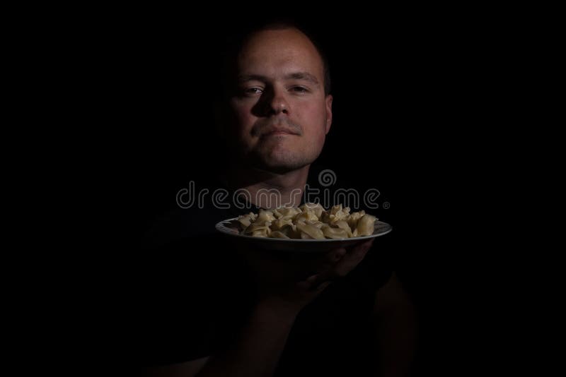 Man with Plate of Dumplings Stock Image - Image of adult, body: 54990829