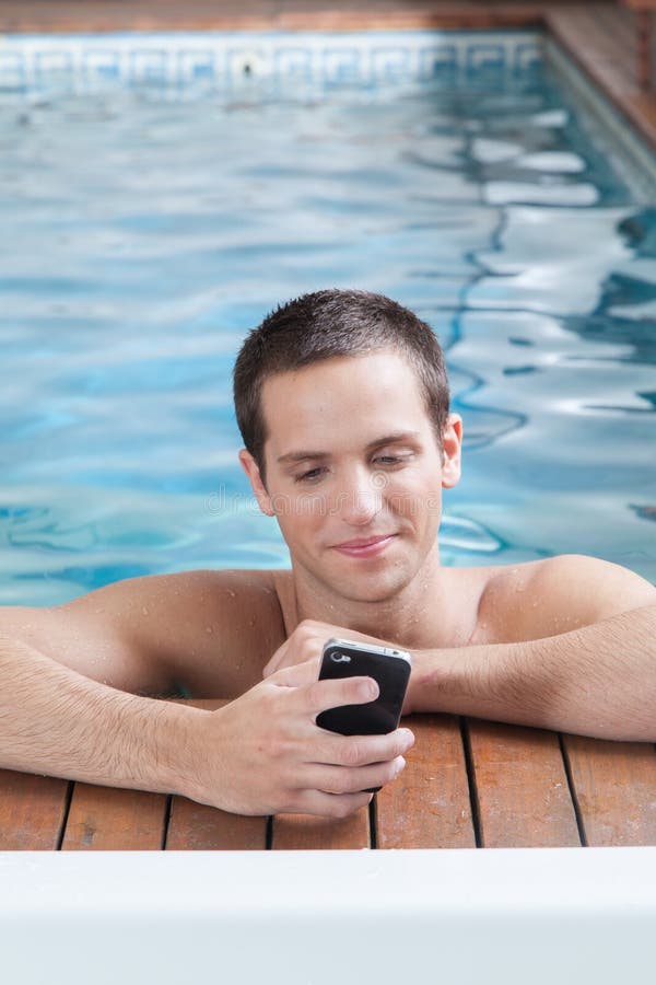 Man Play with Cell in a Pool Stock Image - Image of mobile, resort ...