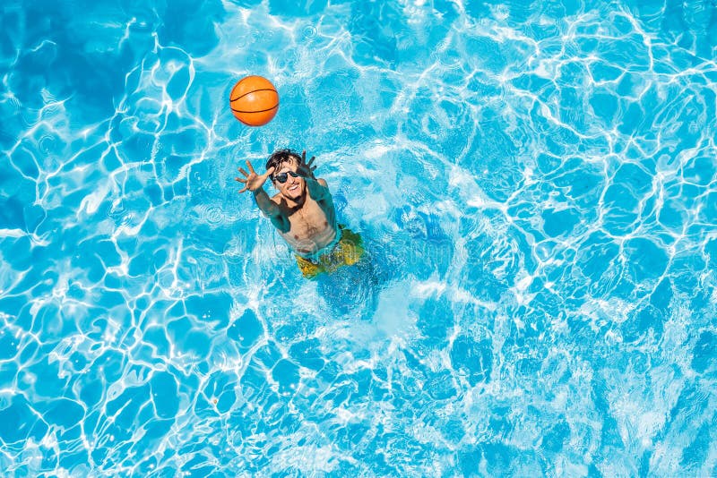 Man Play in the Pool with a Beach Ball Stock Photo - Image of happy ...
