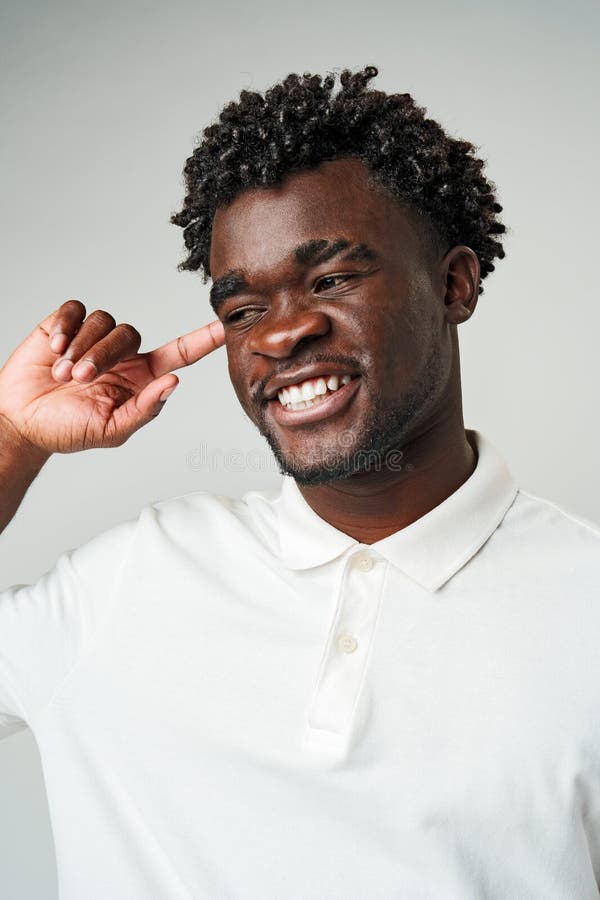 A Man is Playfully Stretching His Face with His Finger Stock Image ...