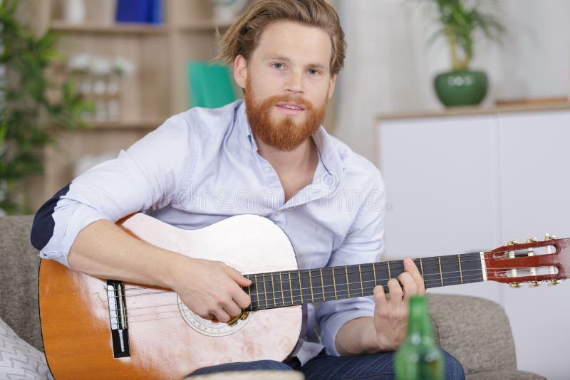 Man Playing Acoustic Guitar Alone Stock Image - Image of casual ...