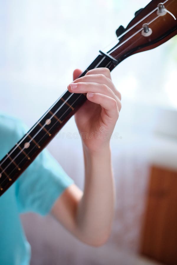 Fingers on a String. Playing the Balalaika Stock Photo - Image of ...